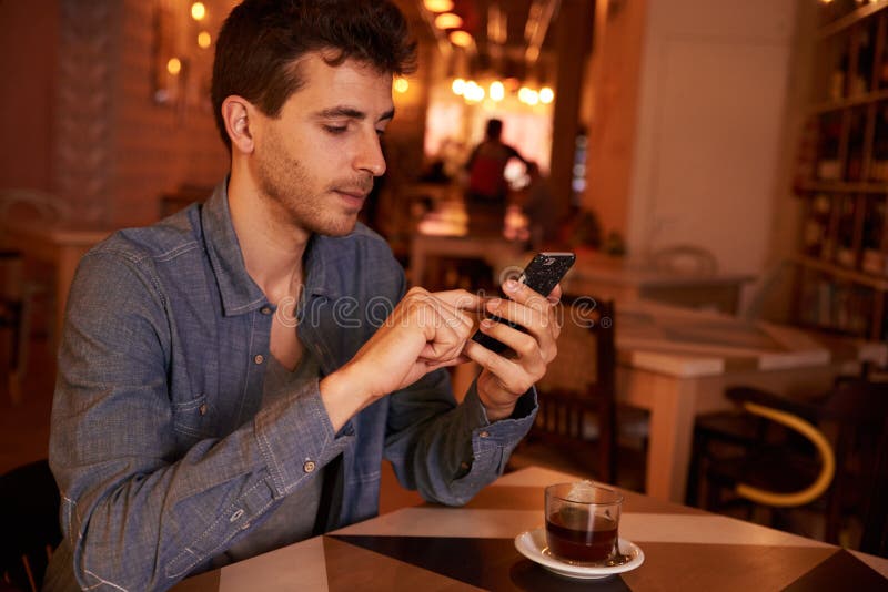 Charming Millenial Texting in a Restaurant Stock Photo - Image of focus ...