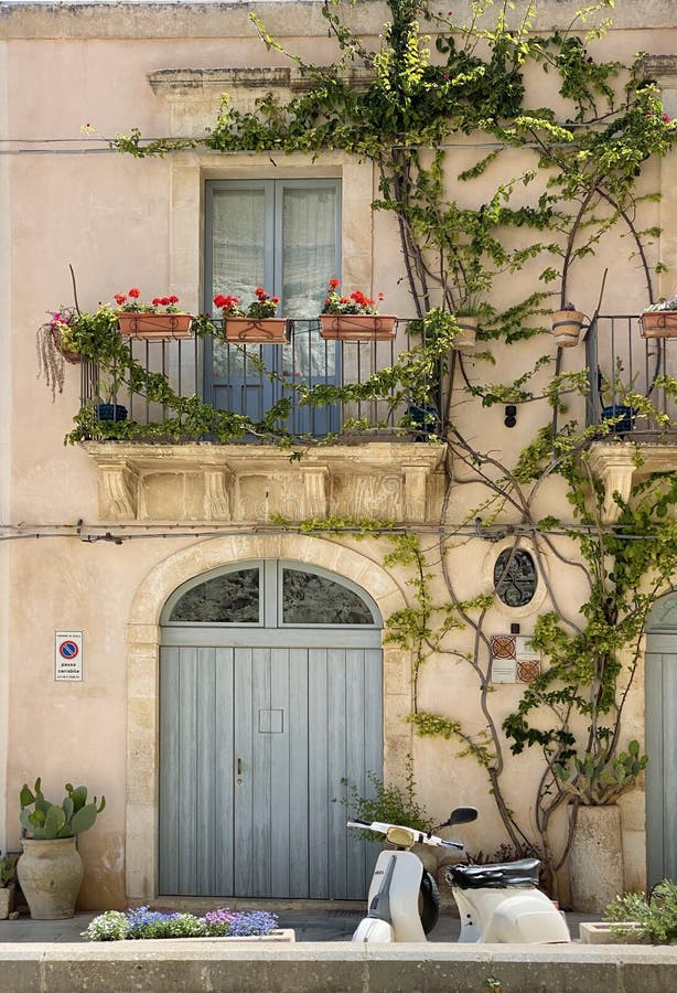Charming Old Italian Building with Climbing Plants and Scooter Stock ...