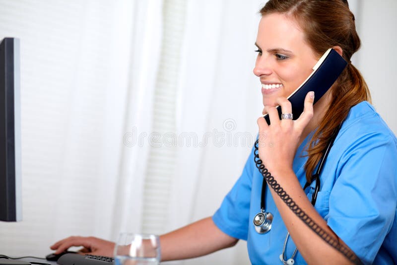 Charming Pretty Nurse Looking on Computer Stock Image - Image of ...