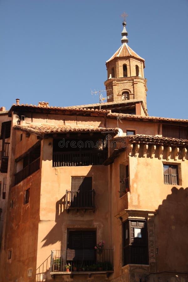 Charming Rustic Building with a Bell Tower Against a Clear Blue Sky in ...