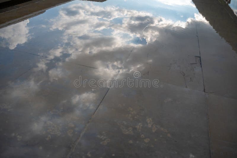 Charming Scene of Reflections Cloudy Sky from Water on Ground Stock ...