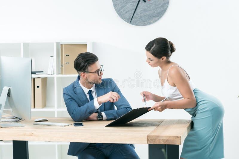 Charming Secretary Talking To Her Boss at Office Stock Image - Image of ...