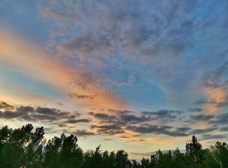 Charming Summer Sky with Whimsical Clouds at Sunset Stock Image - Image ...