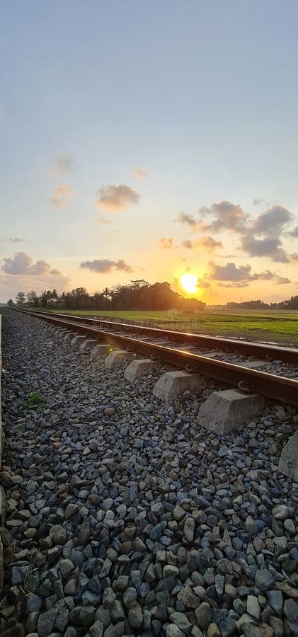 A Charming Sunset Along the Train Tracks Stock Image - Image of ...