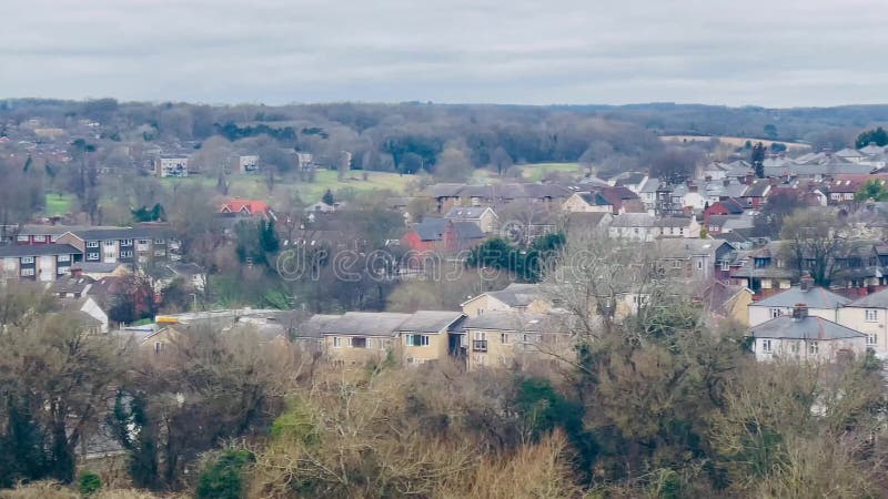 Charming Townscape View Framed by Tree Branches, Prominent Church Spire ...