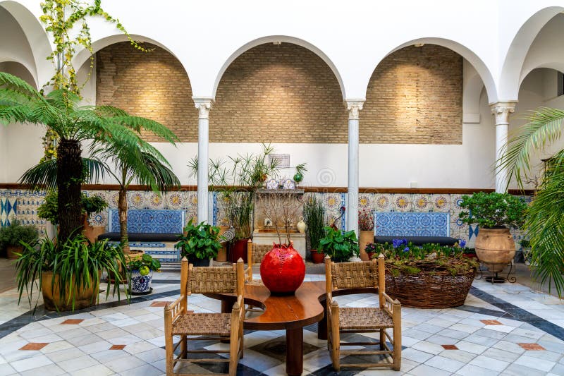 Charming Traditional Courtyard with Arches and Greenery Editorial Stock ...