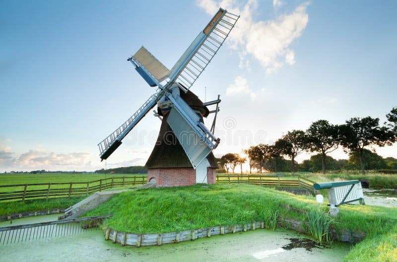 Windmill at Sunrise stock photo. Image of close, awesome - 15550702
