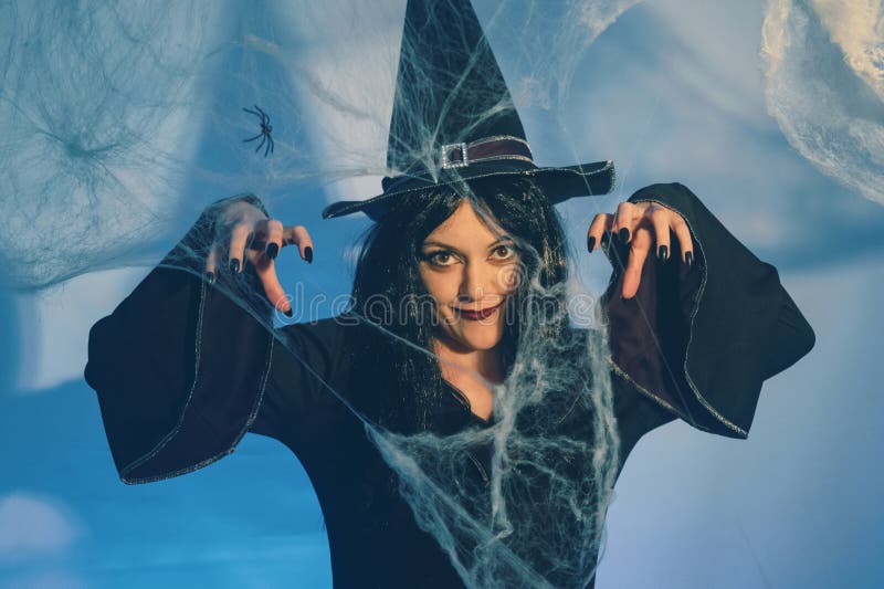 Playful Witch Portrait with Spider Webs for Halloween Stock Image ...