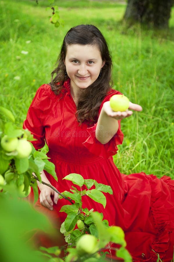 Charming Woman Suggesting an Apple Stock Photo - Image of propose ...