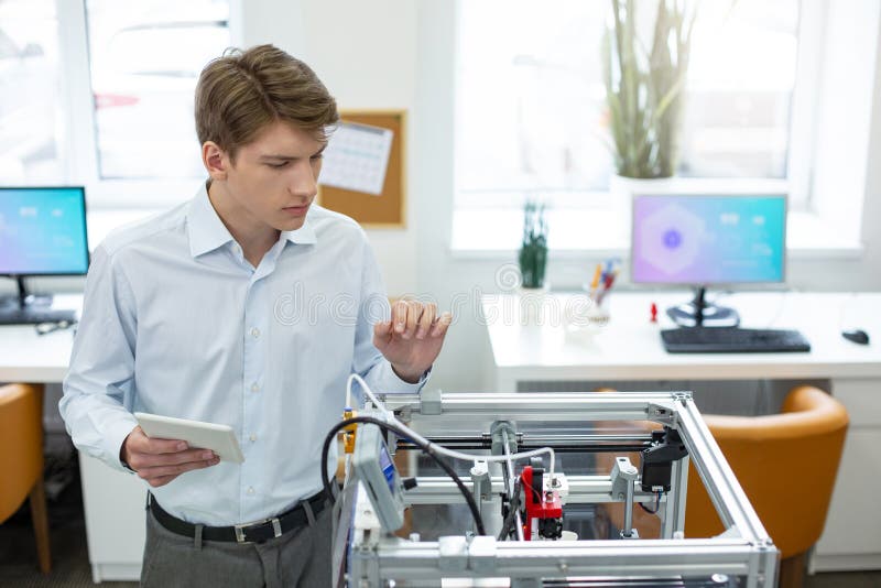 Charming Young Man Observing Mechanism of 3D Printer Stock Photo ...