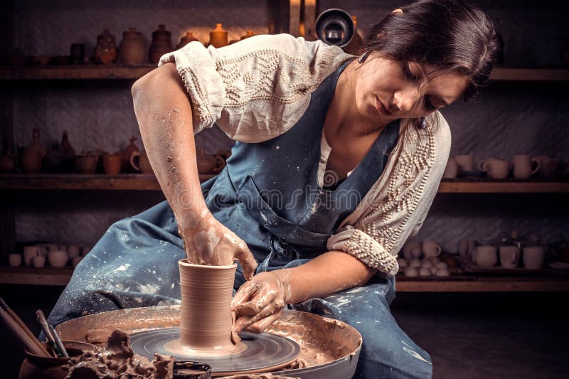 Beautiful Artisan Works with Clay on a Potter`s Wheel. Manual Work ...