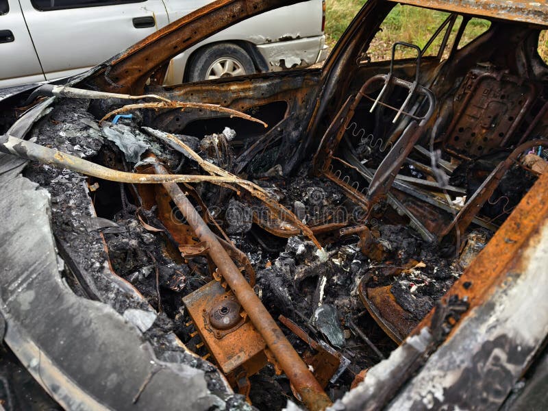 Charred Remnants of a Vehicle Interior Left Behind after a Devastating ...