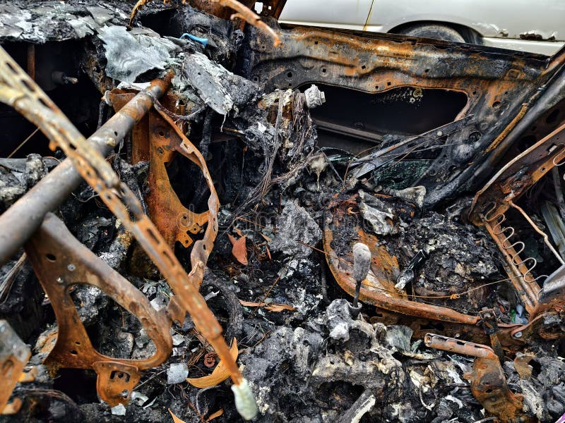 Charred Remnants of a Vehicle Interior Left Behind after a Devastating ...