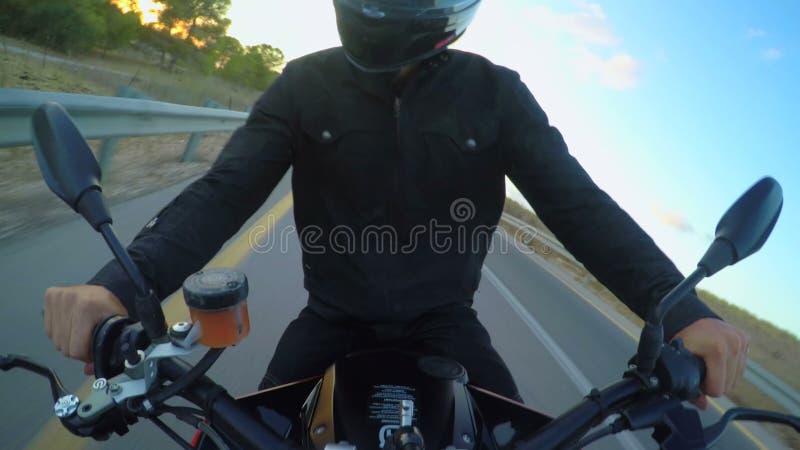 Chase View of a Fast Motorcycle Driving on a Curved Road Stock Video ...