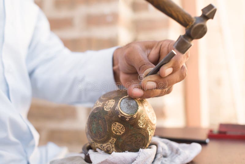 Chaser of copper at work stock photo. Image of gold - 119233784