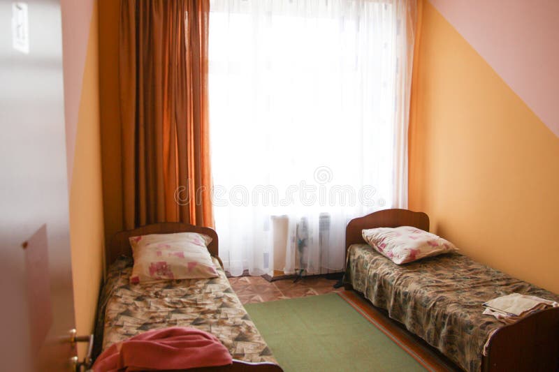 Cheap hotel room stock photo. Image of sheet, rest, blanket - 103650936