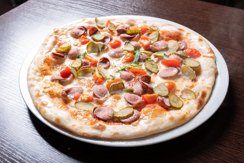 Cheap Pizza with Sausages, Cucumbers, Cherry Tomatoes, and Herbs Stock ...