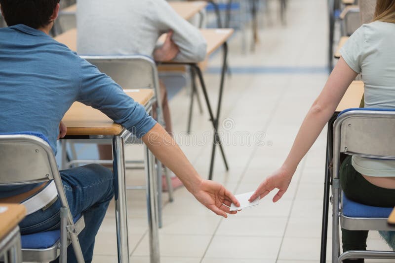 Cheating Students in a Classroom Stock Photo - Image of notes ...