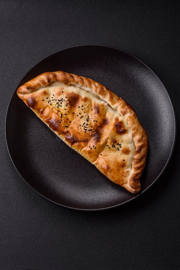 Cheburek Meat Pastry Pie with Herbs on the Concrete Background Stock ...