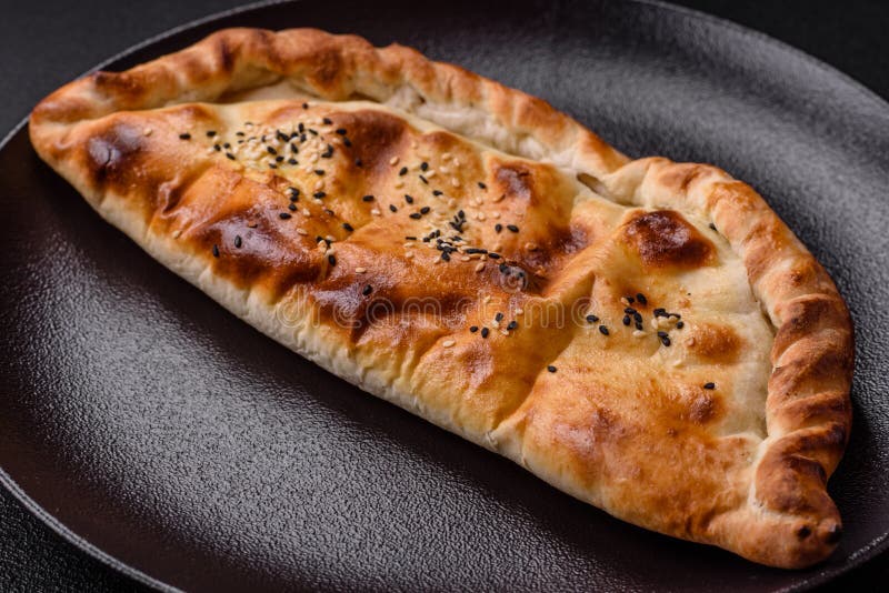Cheburek Meat Pastry Pie with Herbs on the Concrete Background Stock ...