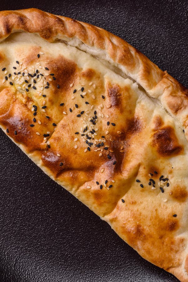 Cheburek Meat Pastry Pie with Herbs on the Concrete Background Stock ...