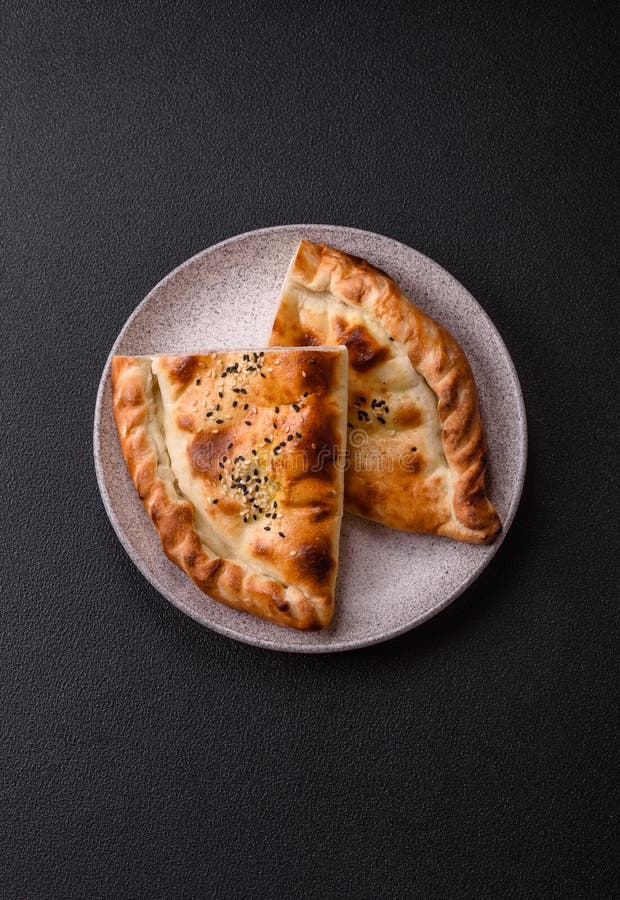 Cheburek Meat Pastry Pie with Herbs on the Concrete Background Stock ...