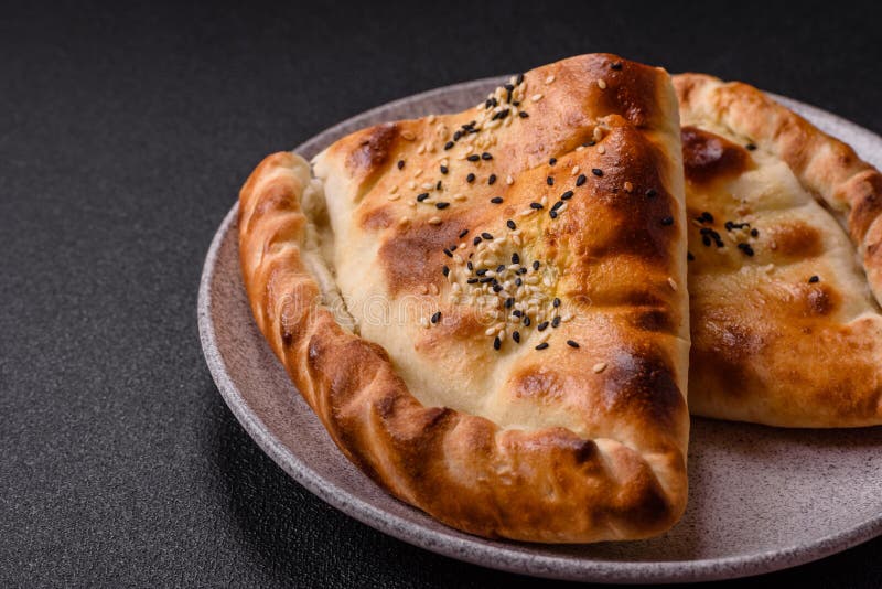 Cheburek Meat Pastry Pie with Herbs on the Concrete Background Stock ...