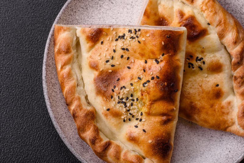Cheburek Meat Pastry Pie with Herbs on the Concrete Background Stock ...