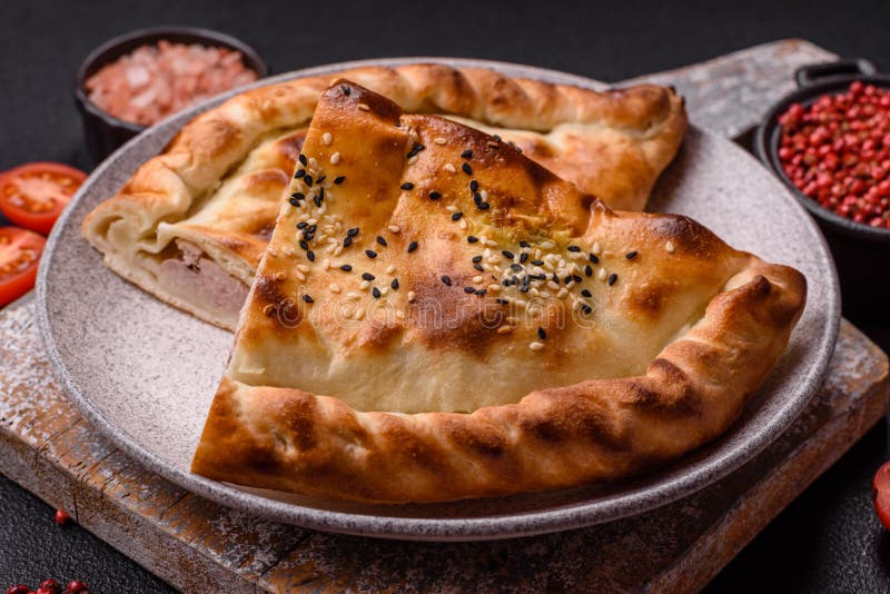 Cheburek Meat Pastry Pie with Herbs on the Concrete Background Stock ...