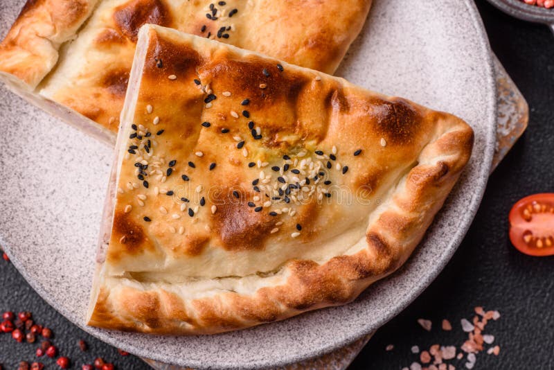 Cheburek Meat Pastry Pie with Herbs on the Concrete Background Stock ...