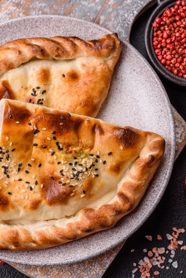Cheburek Meat Pastry Pie with Herbs on the Concrete Background Stock ...