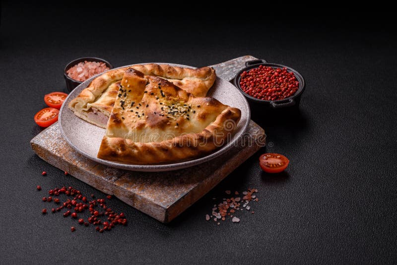Cheburek Meat Pastry Pie with Herbs on the Concrete Background Stock ...