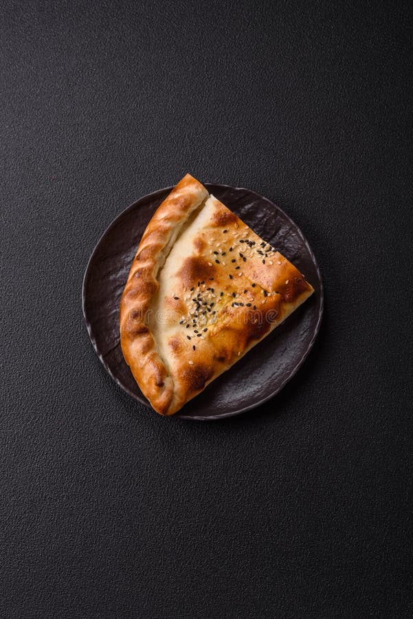 Cheburek Meat Pastry Pie with Herbs on the Concrete Background Stock ...