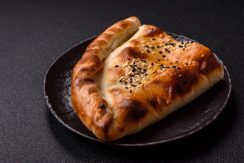 Cheburek Meat Pastry Pie with Herbs on the Concrete Background Stock ...