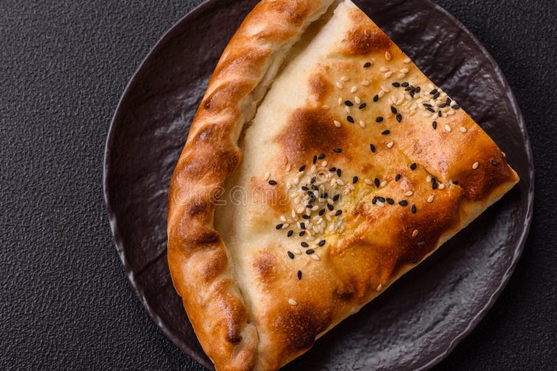 Cheburek Meat Pastry Pie with Herbs on the Concrete Background Stock ...