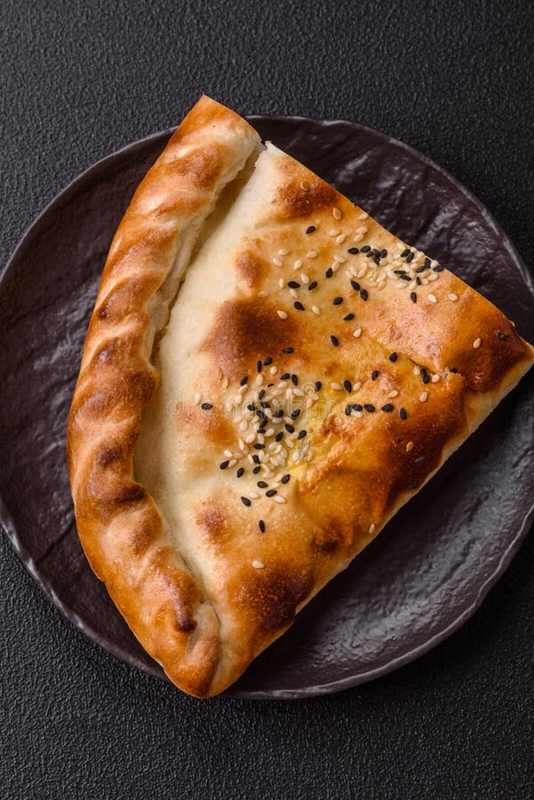 Cheburek Meat Pastry Pie with Herbs on the Concrete Background Stock ...