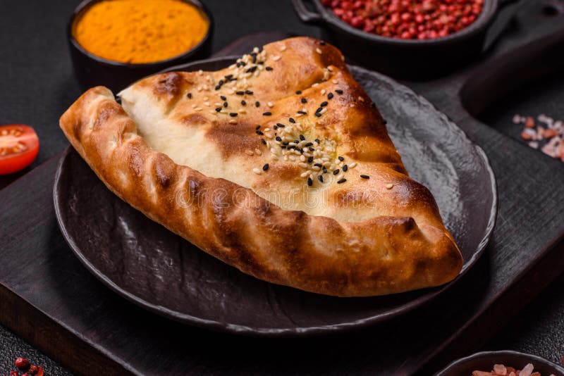 Cheburek Meat Pastry Pie with Herbs on the Concrete Background Stock ...