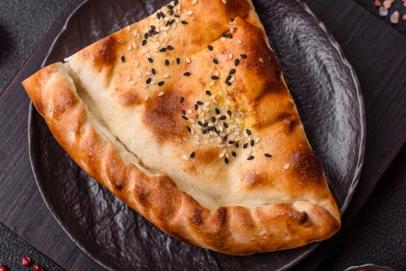 Cheburek Meat Pastry Pie with Herbs on the Concrete Background Stock ...
