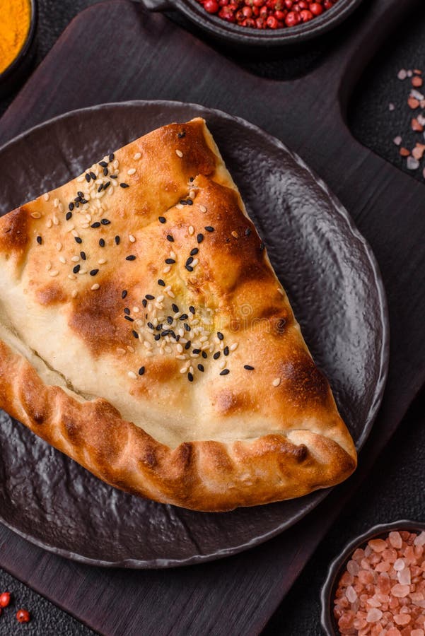 Cheburek Meat Pastry Pie with Herbs on the Concrete Background Stock ...