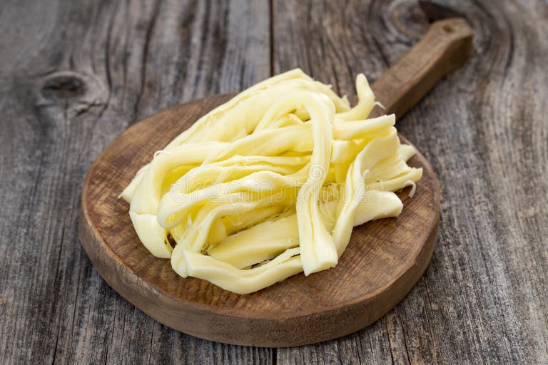 Chechil Cheese or String Cheese on Wood Floor. Stock Image - Image of ...