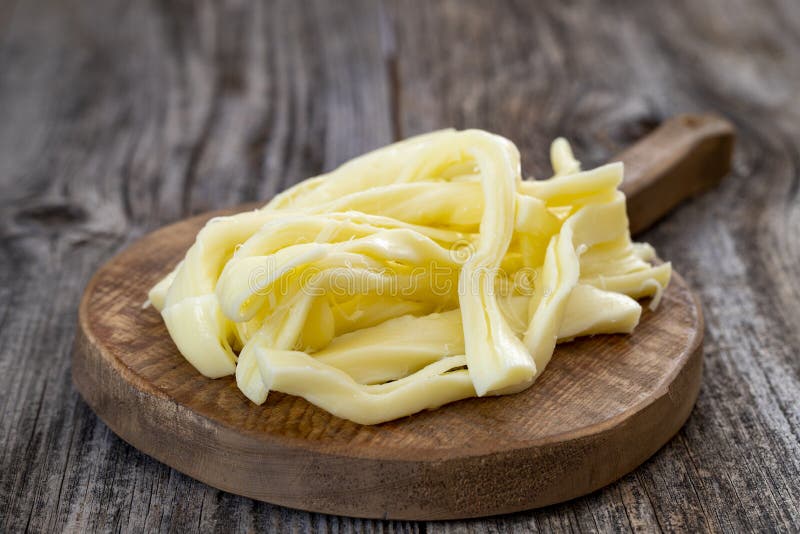 Chechil Cheese or String Cheese on Wood Floor. Stock Image - Image of ...