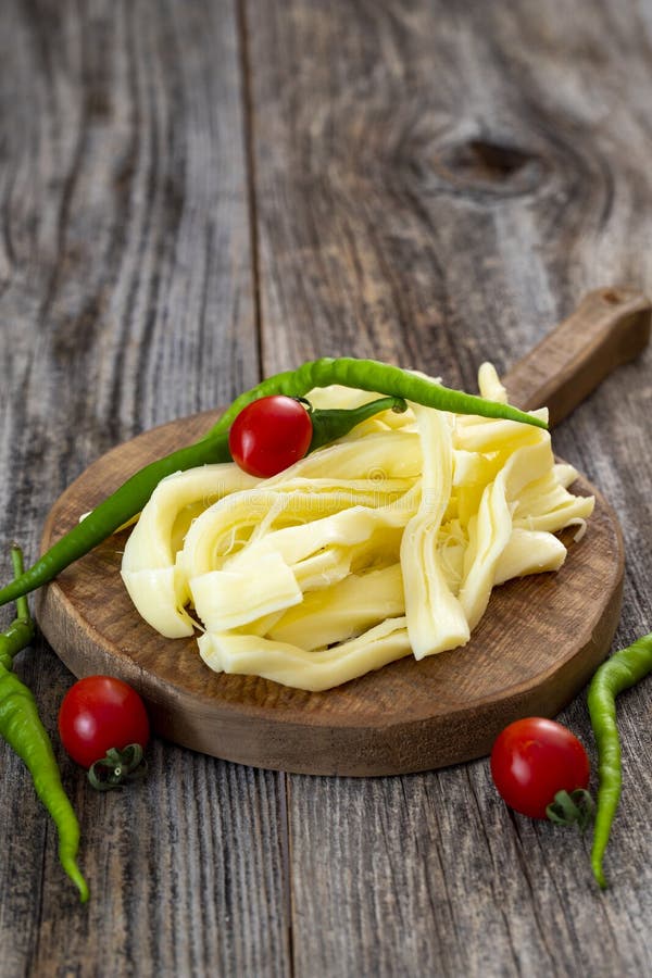 Chechil Cheese or String Cheese on Wood Floor. Stock Image - Image of ...