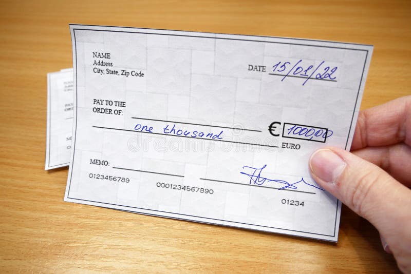 Check Financial Payment, Paycheck in Hand on Table Background, Hand ...