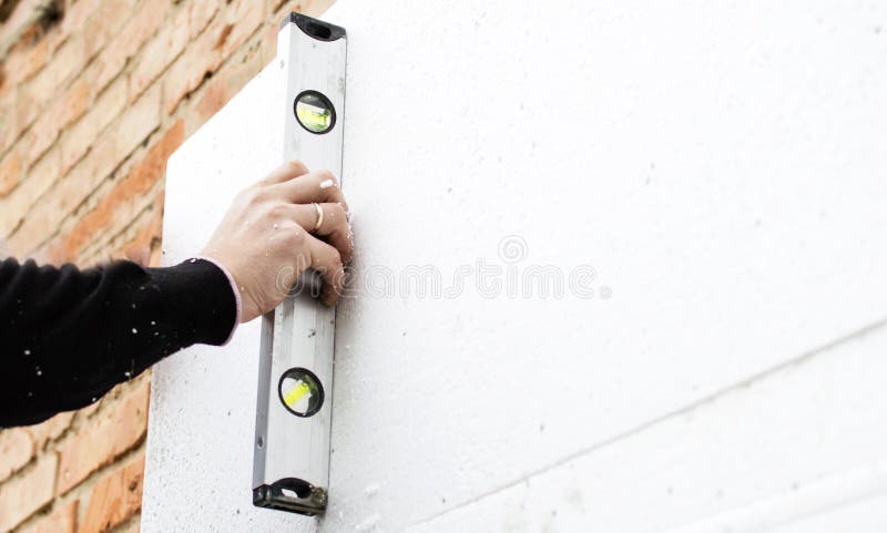 Check Flatness of the Wall Using a Level Stock Photo - Image of walls ...