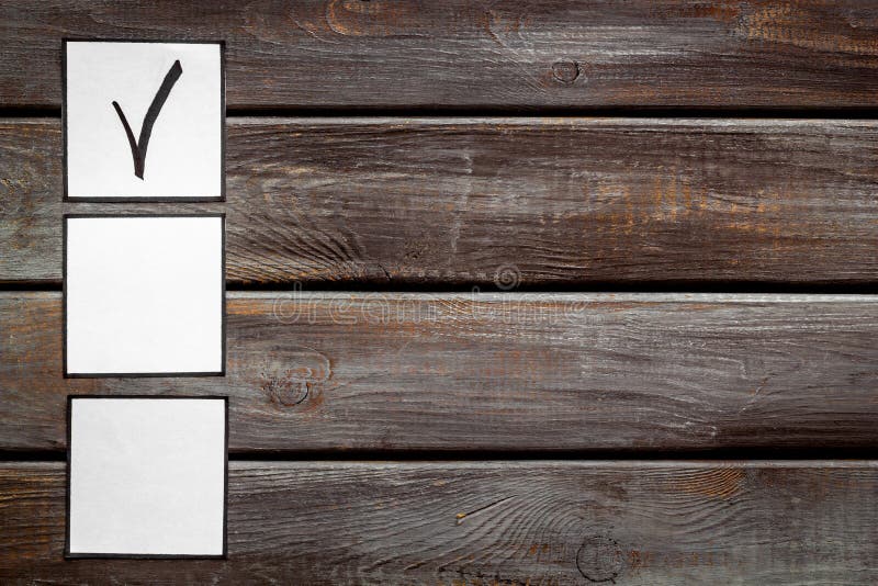 Check Mark in Check-box on Dark Wooden Background Top View Space for ...