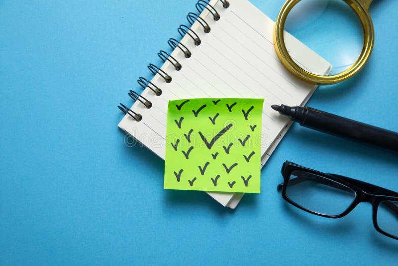 Check Marks on Sticky Note with a Business Objects on the Blue ...