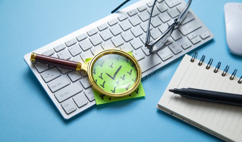 Check Marks on Sticky Note with a Business Objects on the Blue ...