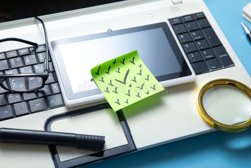 Check Marks on Sticky Note with a Business Objects on the Blue ...