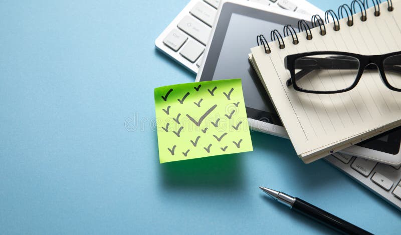 Check Marks on Sticky Note with a Business Objects on the Blue ...