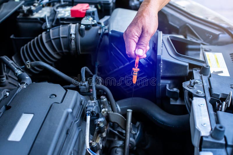 Check the Oil Level in Car Engine. Mechanic Checking Car Engine or ...